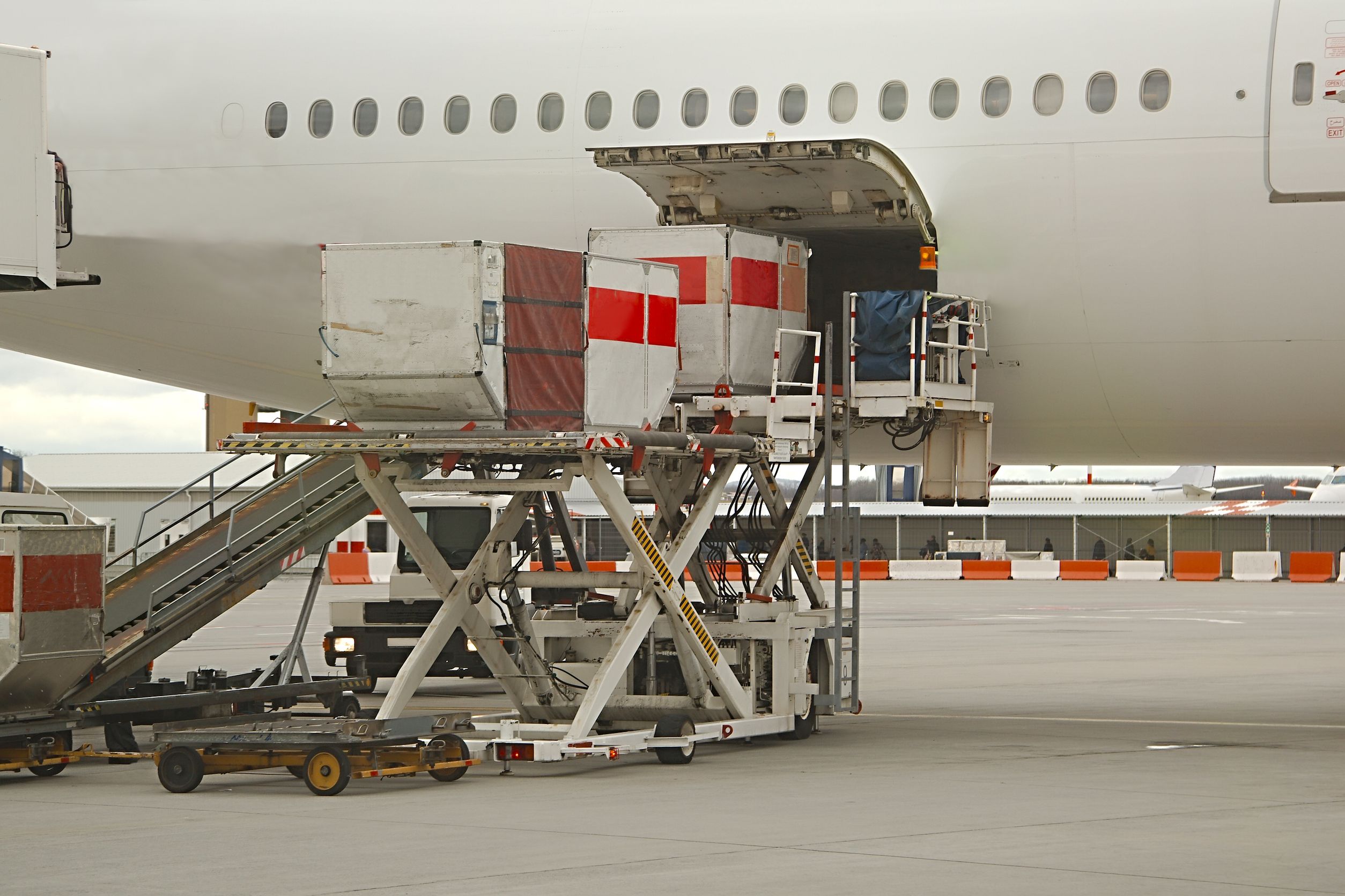 loading cargo containers into an airliner - A1 Worldwide Logistics, Inc